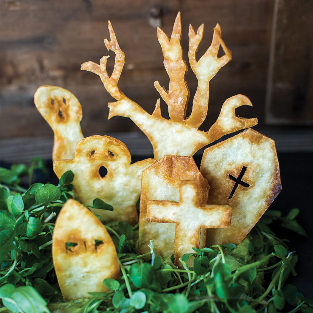Spooky tortilla graveyard with guacamole dip | easyFood